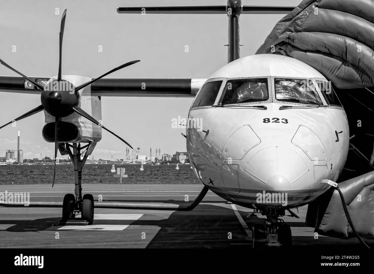 Front view of white modern turboprop airliner with close-up of pointed ...