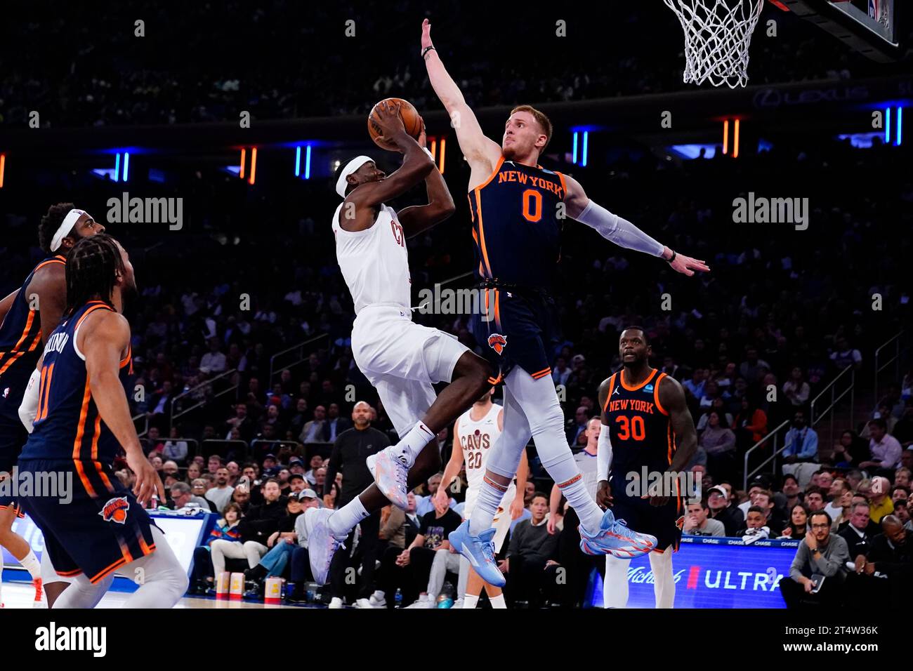 Cleveland Cavaliers' Caris LeVert, shoots over New York Knicks' Donte ...