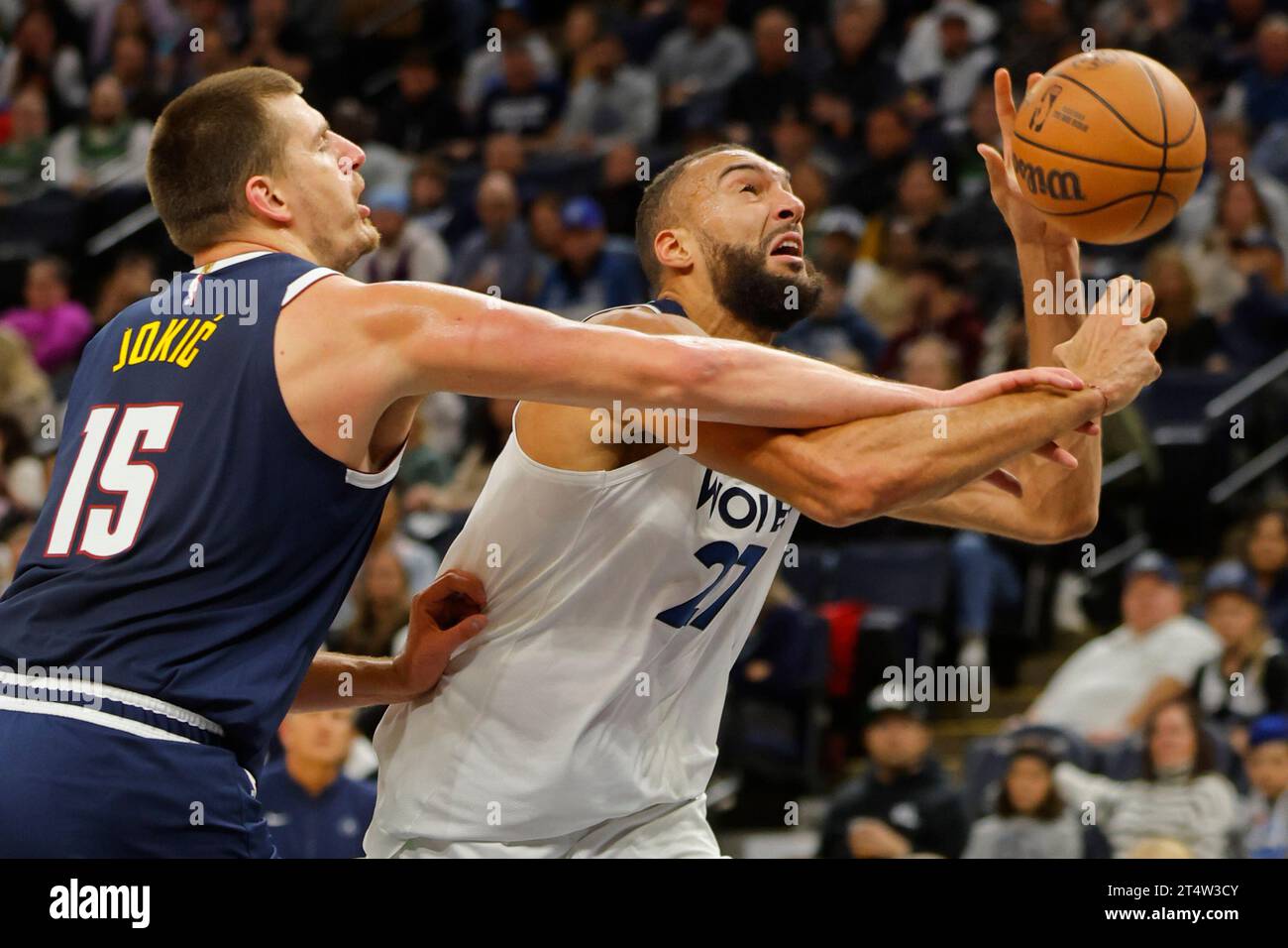Denver Nuggets center Nikola Jokic (15) defends against Minnesota Timberwolves center Rudy ...