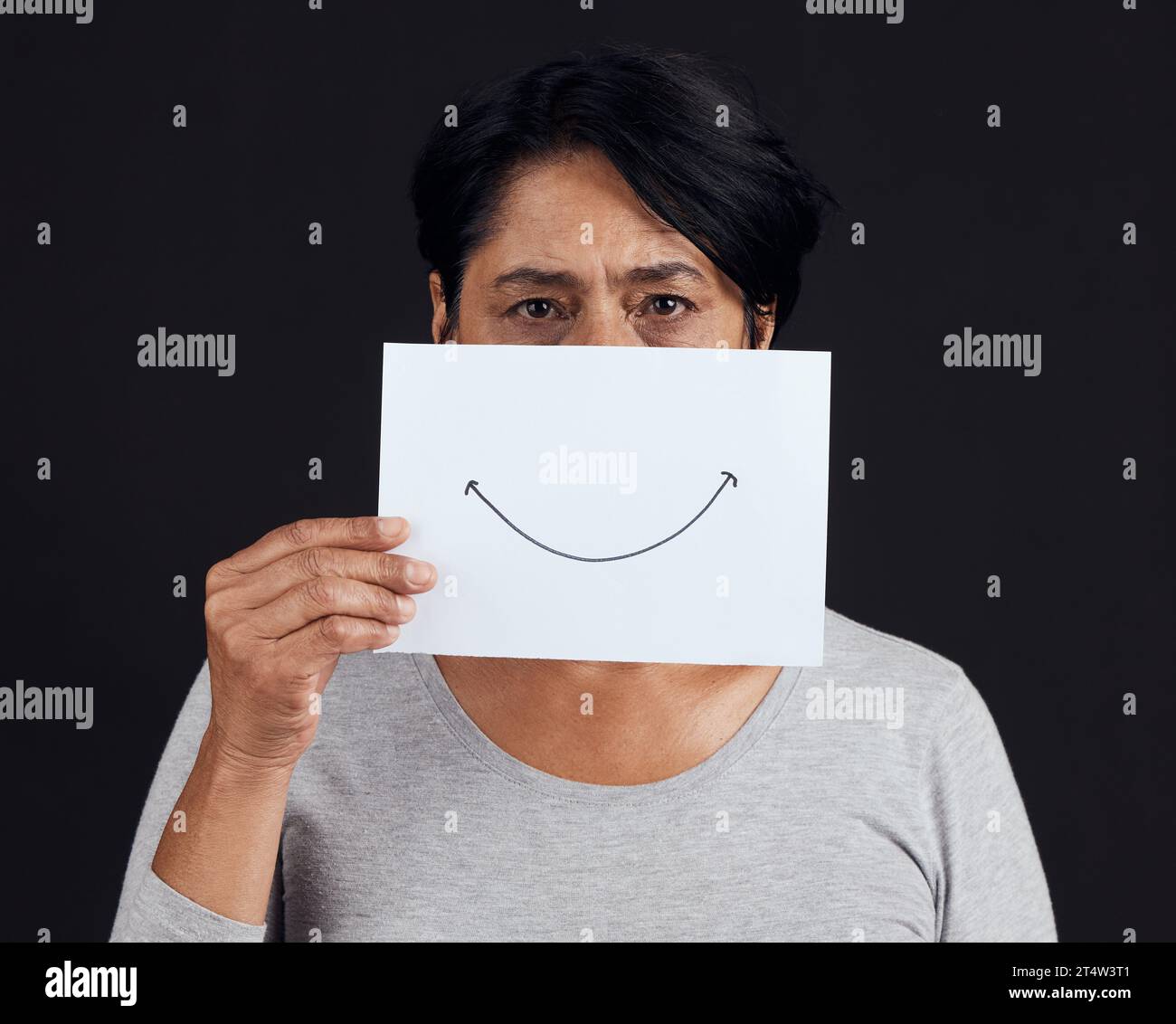 Portrait, fake smile or depression and a mature woman in studio on a ...