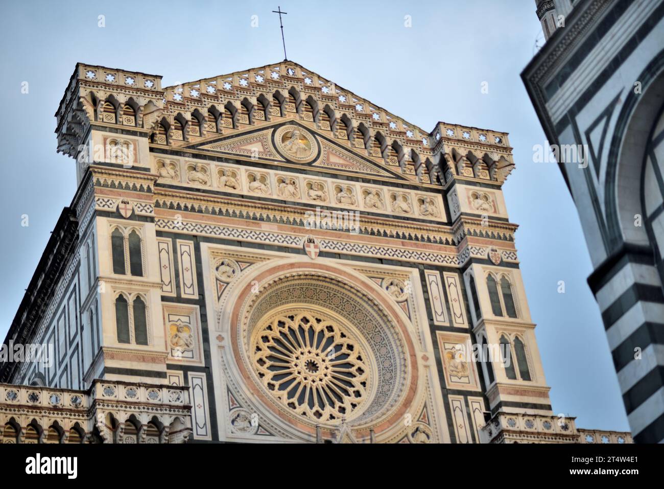 A traditional church, featuring two tall towers with large windows ...