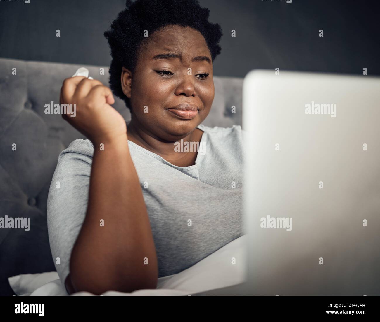 Sad, crying and a black woman with a laptop in bed for a movie, film or ...