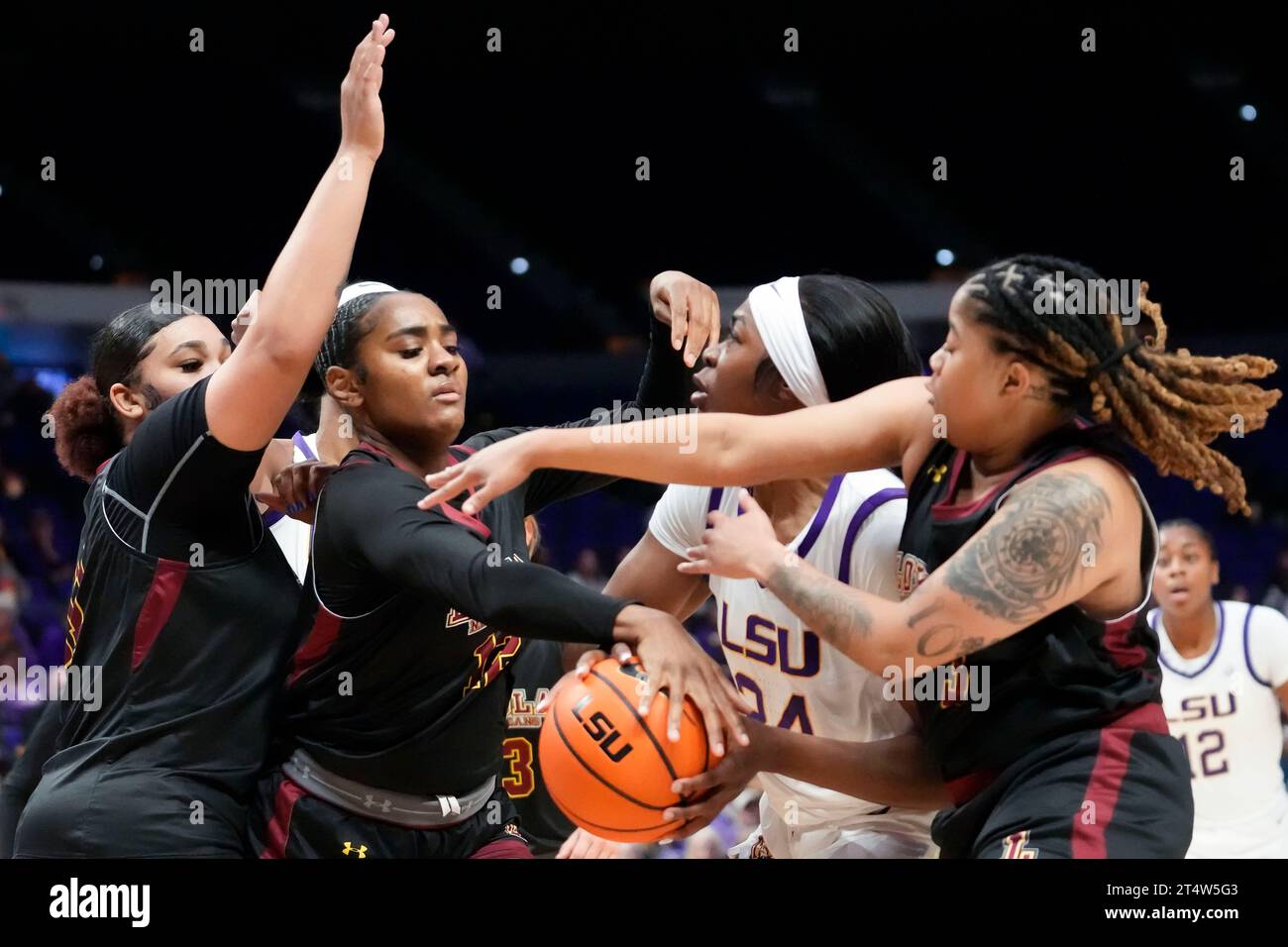 LSU forward Aneesah Morrow (24) battles under the basket with Loyola ...