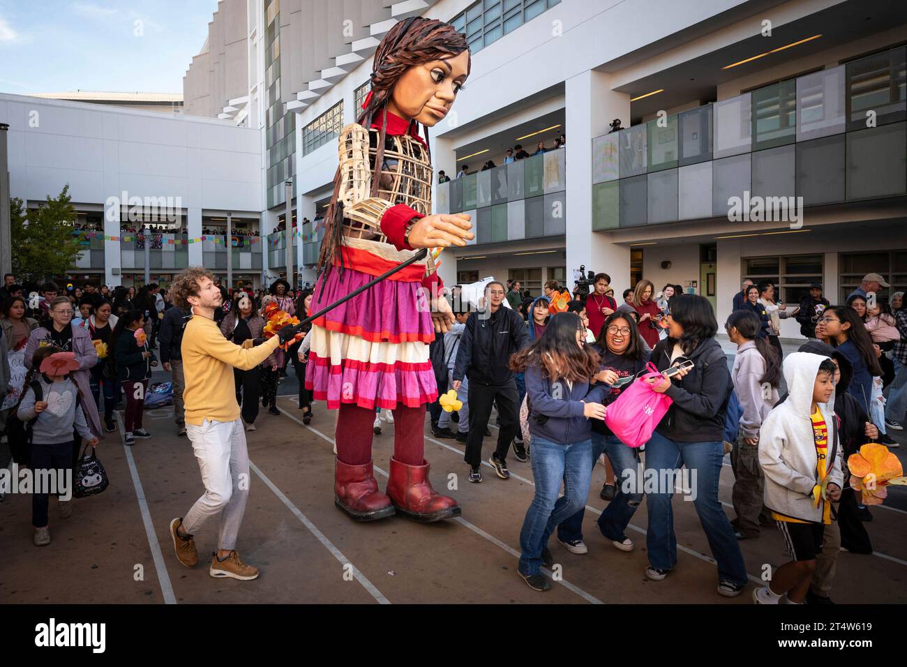 Little Amal, a 12-foot puppet in the image of a 10-year-old Syrian ...
