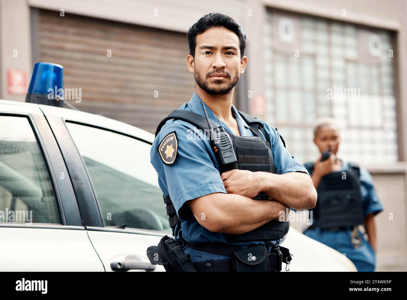 Asian man, police and arms crossed in city for law enforcement ...