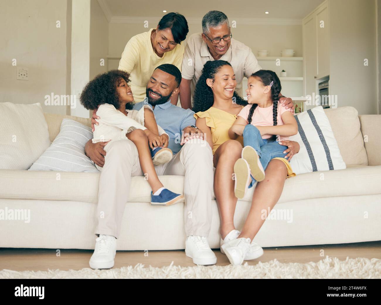 Grandparents, mother and father with children, home and quality time ...