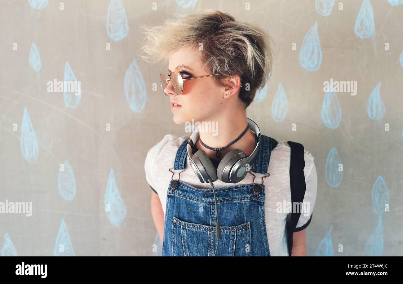 Fashion, music and a gen z woman thinking in studio on a rain wallpaper ...