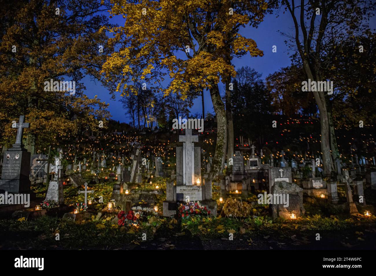 Candles are lit on the tombs to mark the All Saints' Day at the Rasos ...