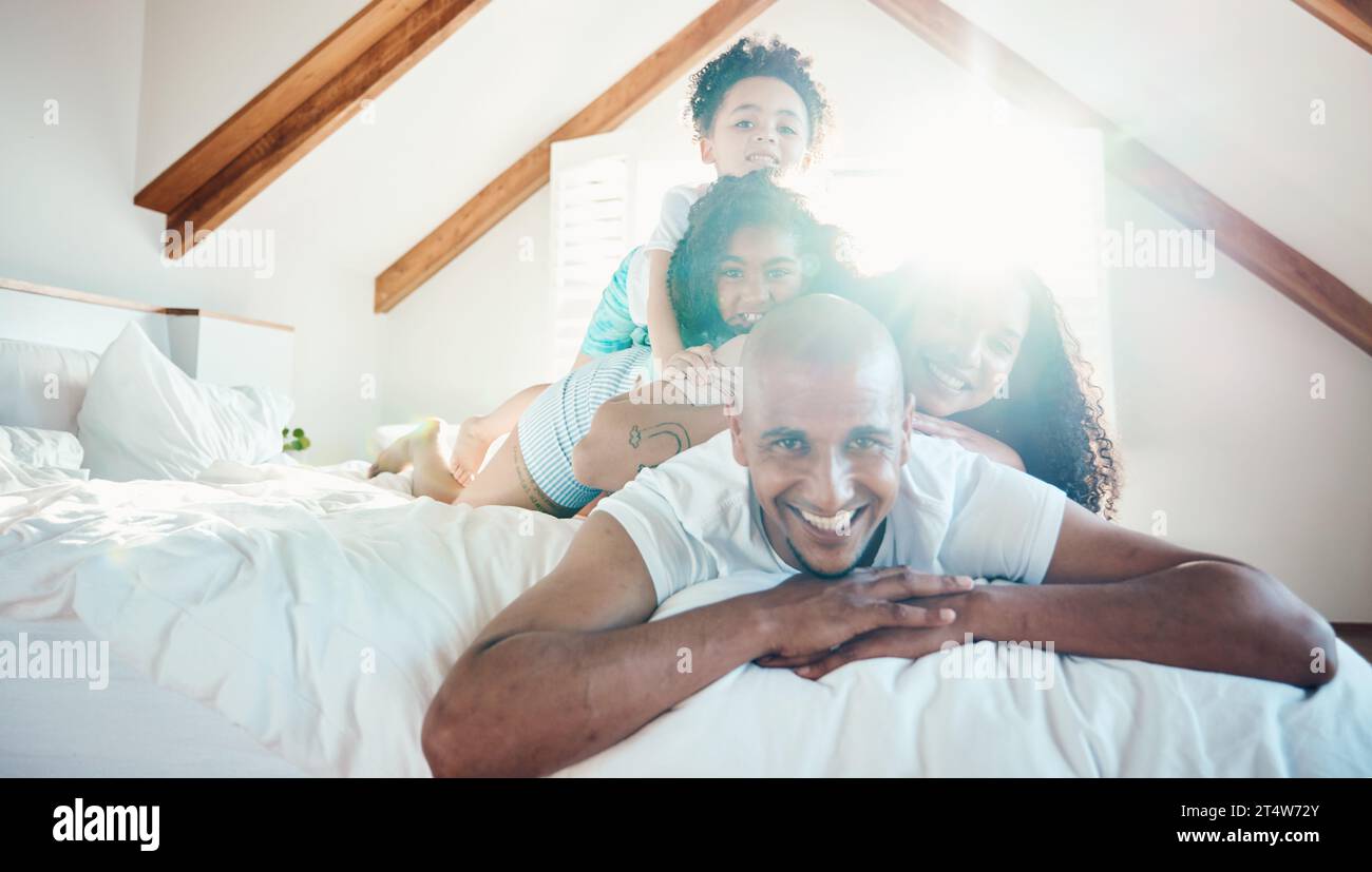 Pile, family and portrait in home bedroom, bonding and sunshine with ...