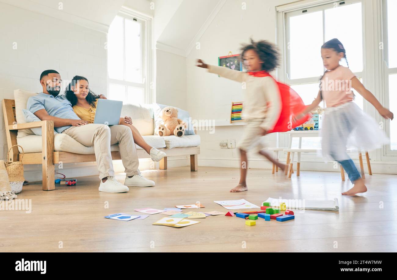 Parents on laptop, happy family and running children playing pretend ...