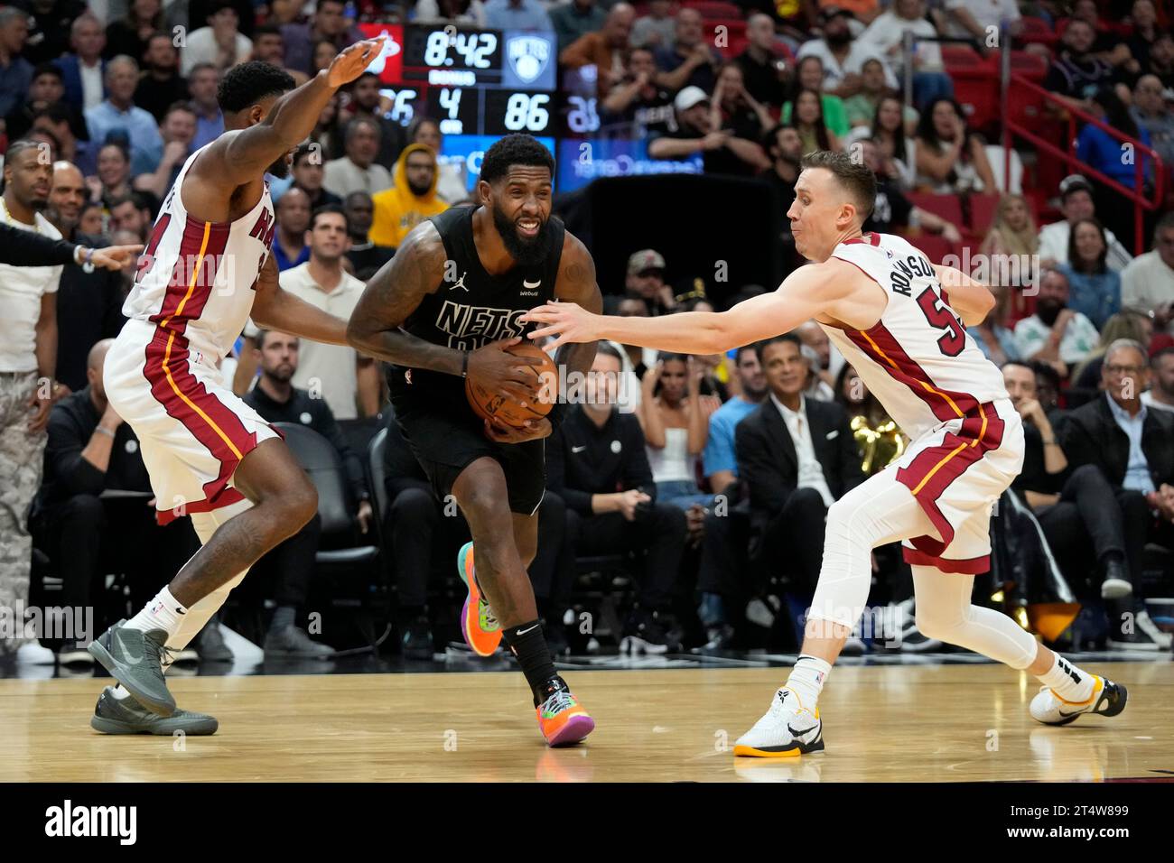 Brooklyn Nets forward Royce O'Neale, center, drives past Miami Heat ...
