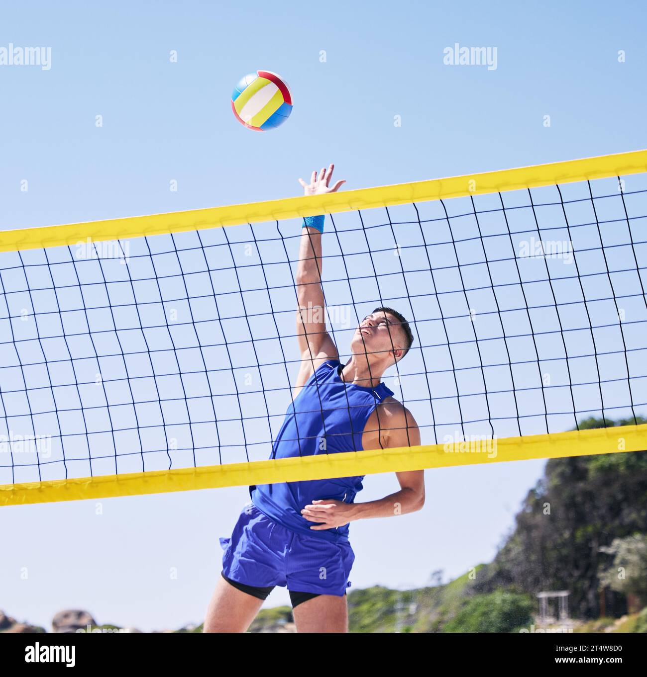 Beach, volleyball and man with arm stretch ocean and sea with exercise ...