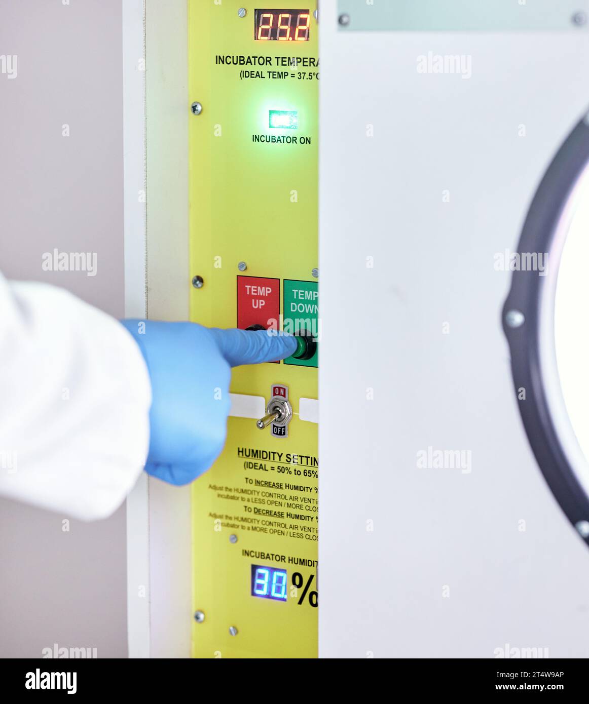 Laboratory, temperature and hands on button on machine for science ...