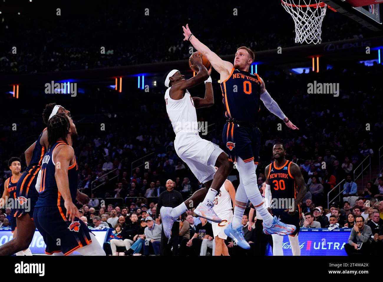 Cleveland Cavaliers' Caris LeVert, shoots over New York Knicks' Donte ...