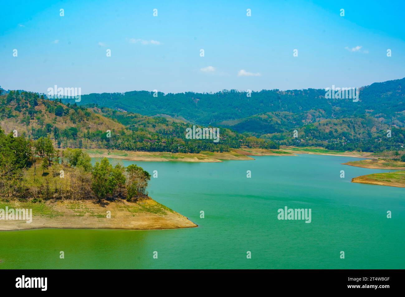 A tranquil man made lake nestled among towering peaks Stock Photo - Alamy