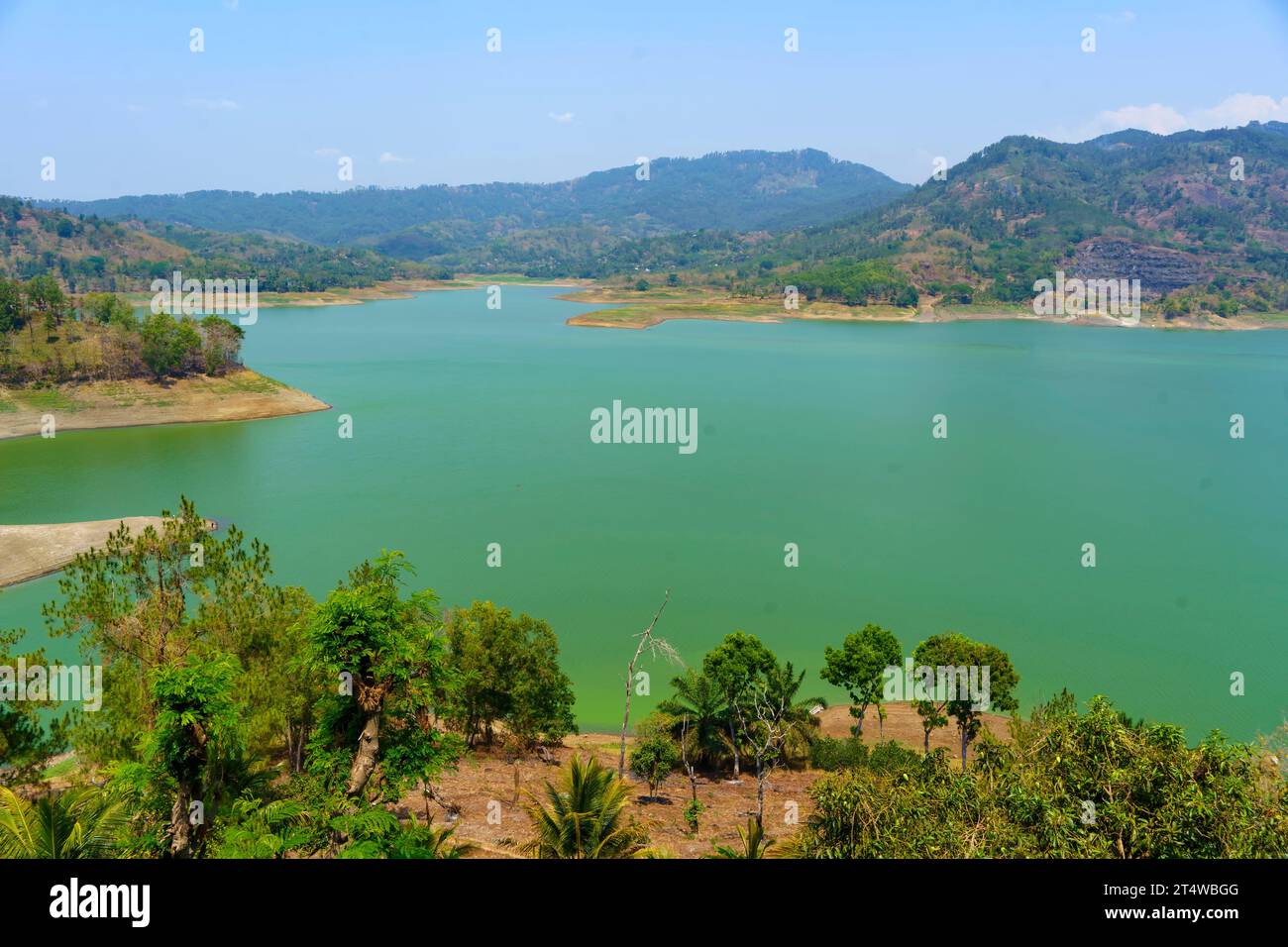A tranquil man made lake nestled among towering peaks Stock Photo - Alamy