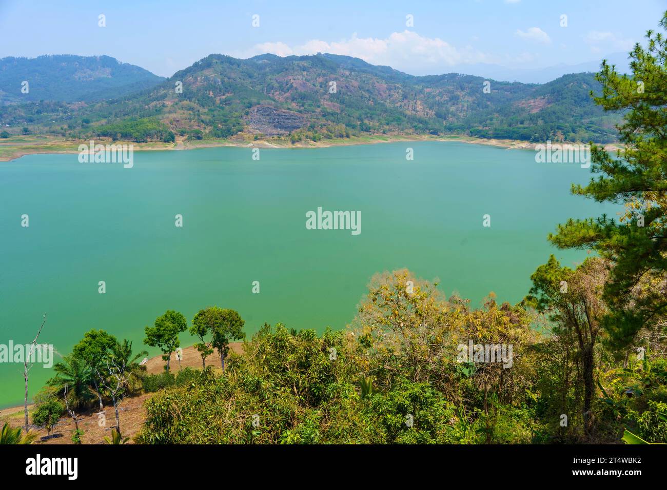 A tranquil man made lake nestled among towering peaks Stock Photo - Alamy