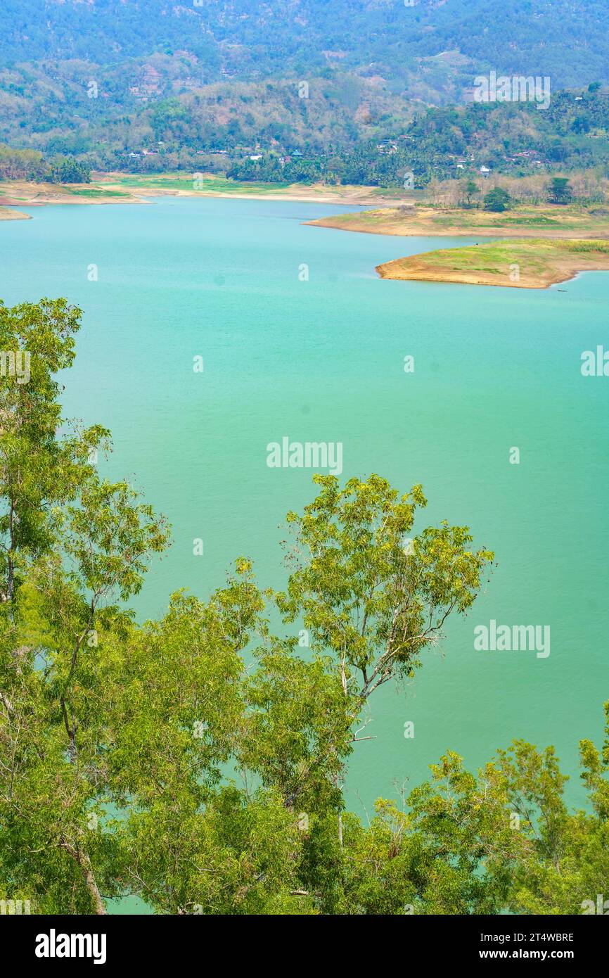 A tranquil man made lake nestled among towering peaks Stock Photo - Alamy