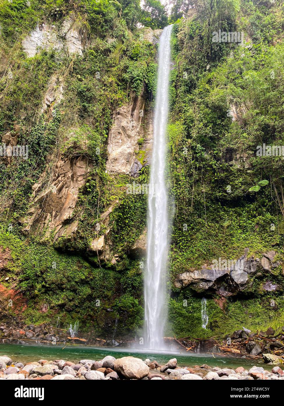 Katibawasan Falls surrounded by tropical forest in Camiguin Island ...