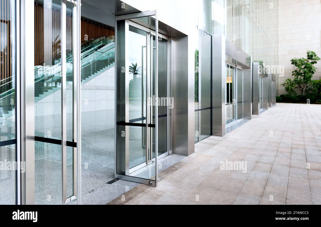 Glass door of modern office building Stock Photo - Alamy