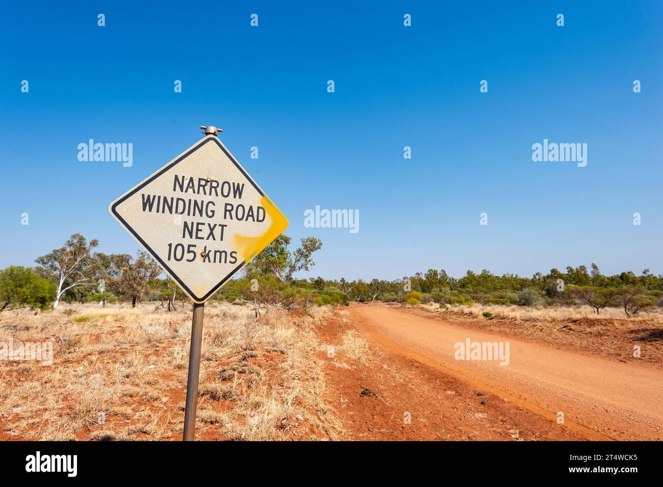 Narrow winding road warning sign for the Skull Springs Road, Pilbara ...