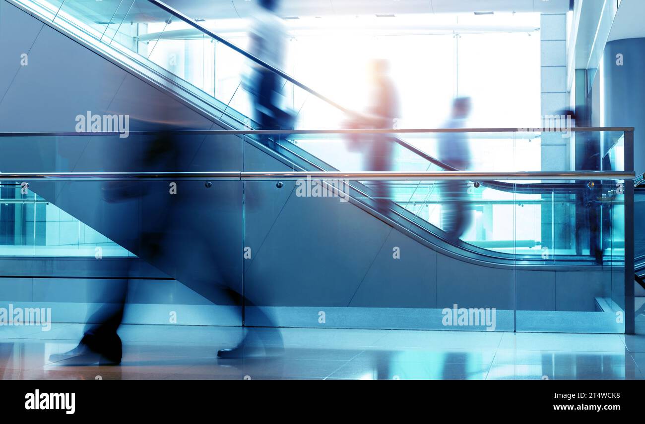 Business people rushing in the lobby Stock Photo - Alamy