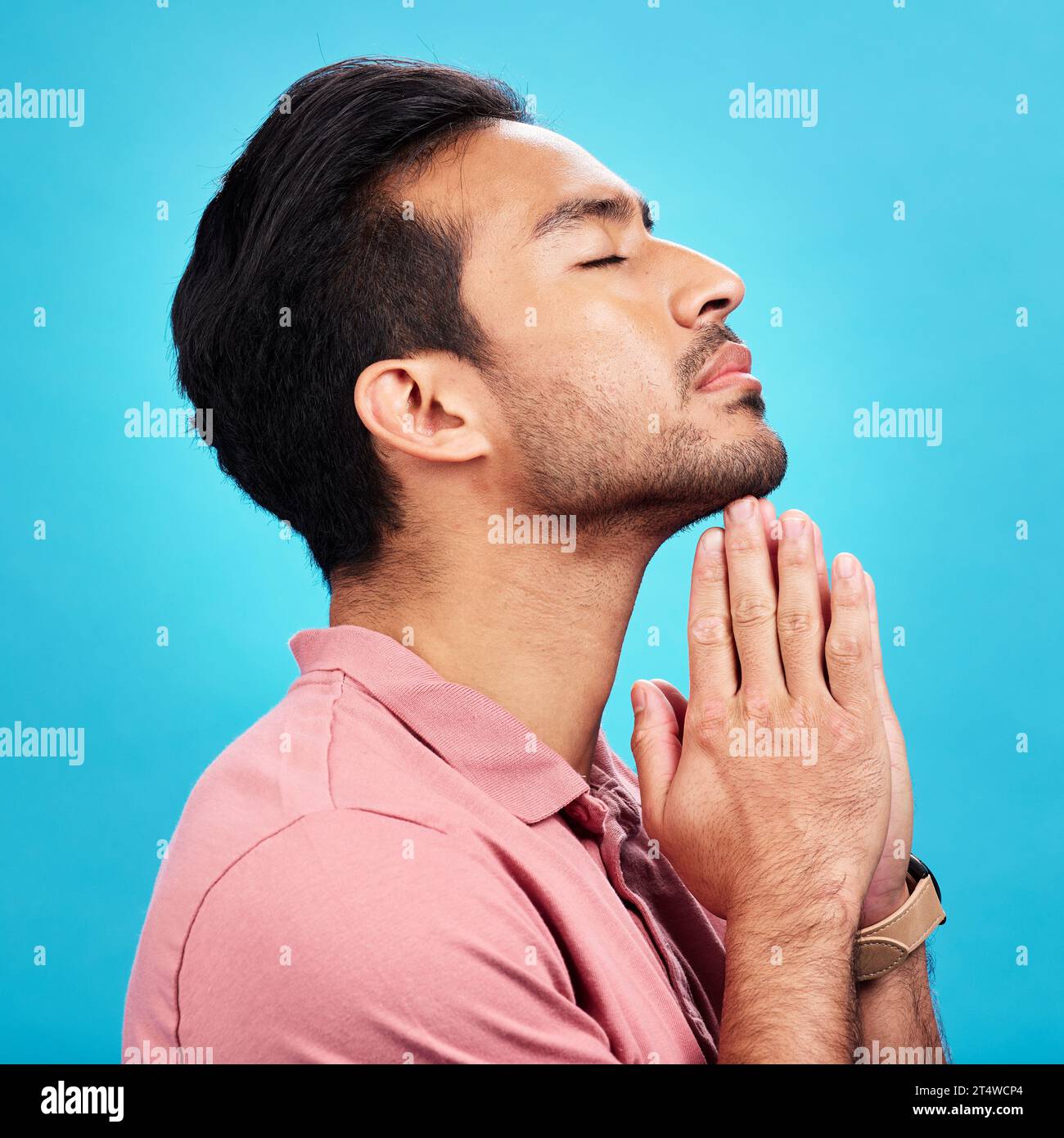 Profile, religion and praying man in studio isolated on a blue ...
