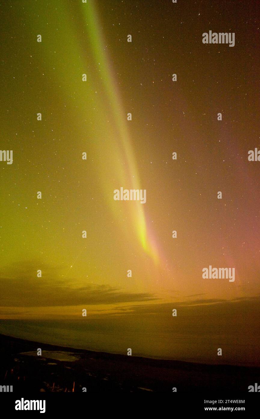 Northern lights Aurora borealis glow brightly and shoot across the ...