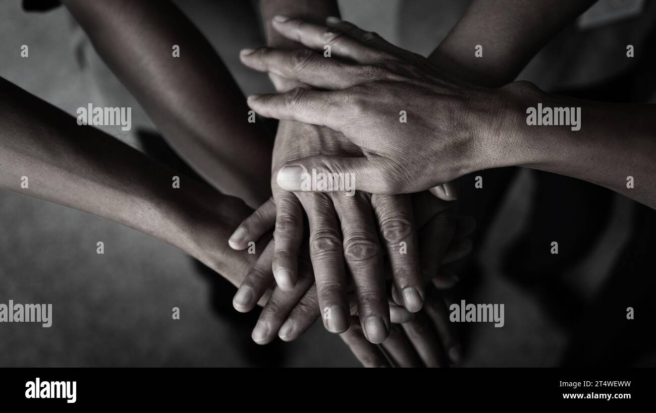 People putting hands together, team work concept Stock Photo - Alamy