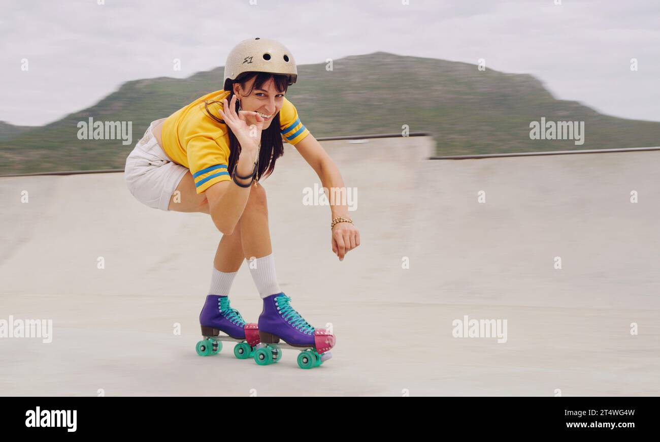 Rollerskate, extreme sports and woman with perfect sign or hand gesture ...