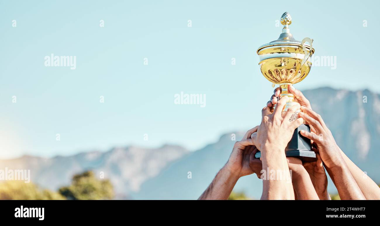 Sports, win and hands of a team with a trophy for an achievement, goal ...