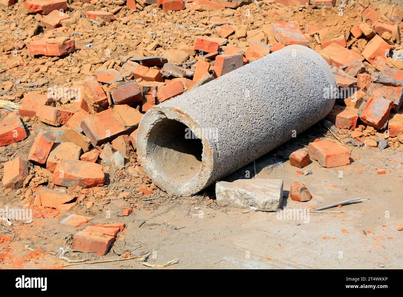 Cement well pipes and bricks Stock Photo - Alamy