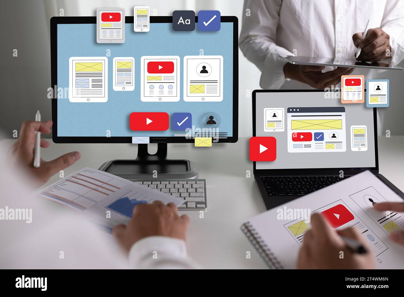 Team designers work on UI and UX designs for mobile app technology ...