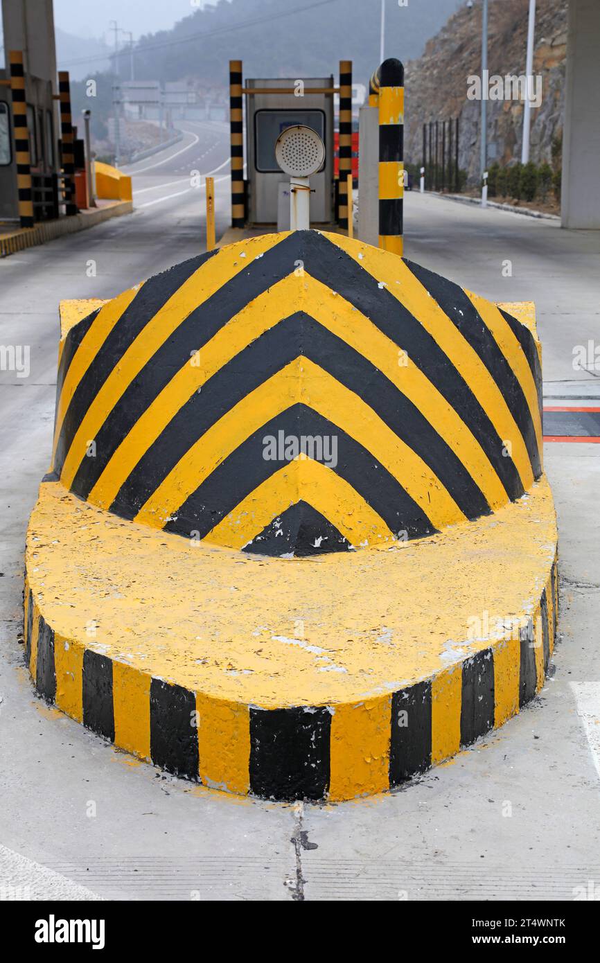 Yellow warning building at toll booth Stock Photo - Alamy