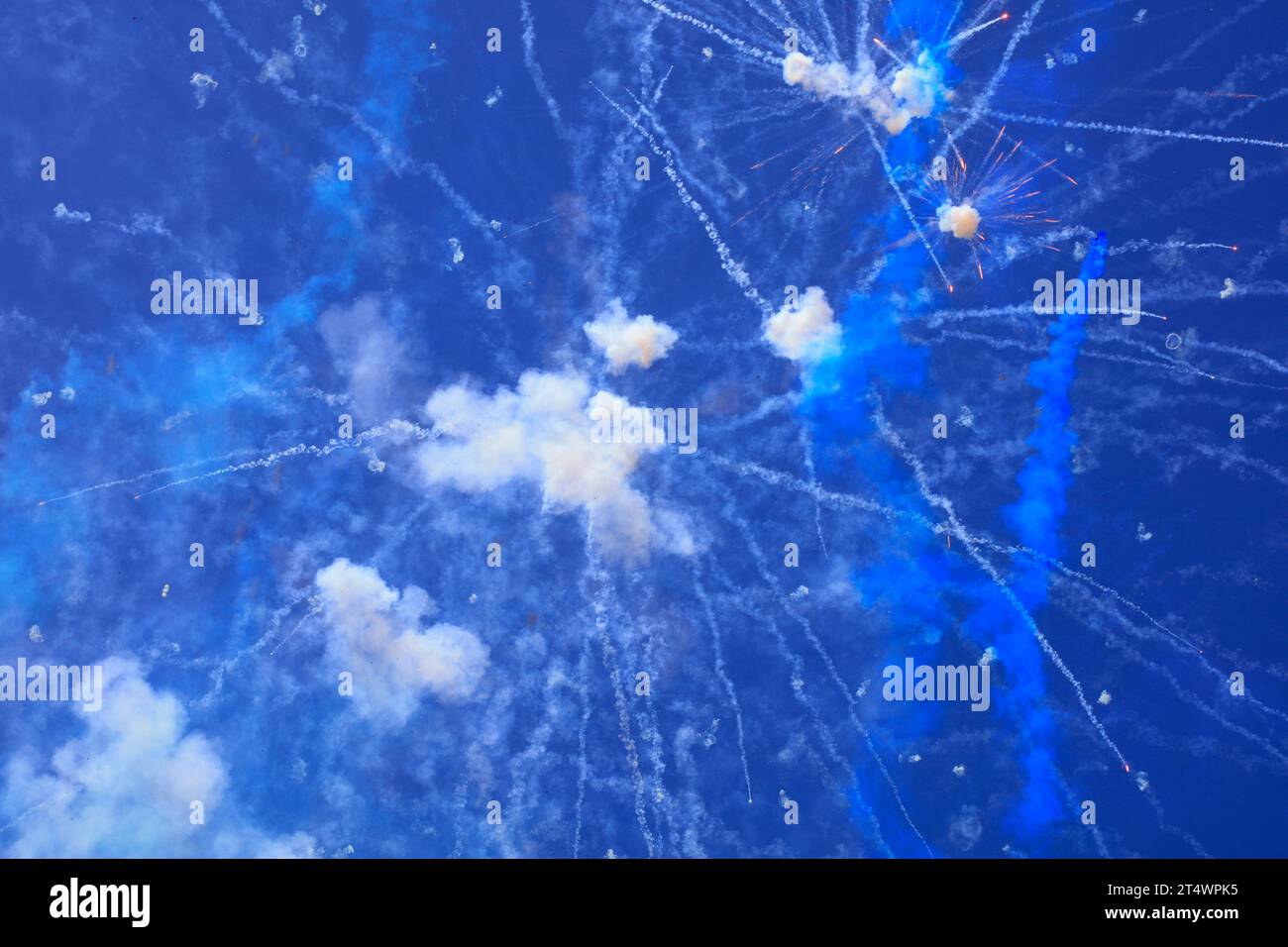 Fireworks explode, smoke in the blue sky Stock Photo - Alamy