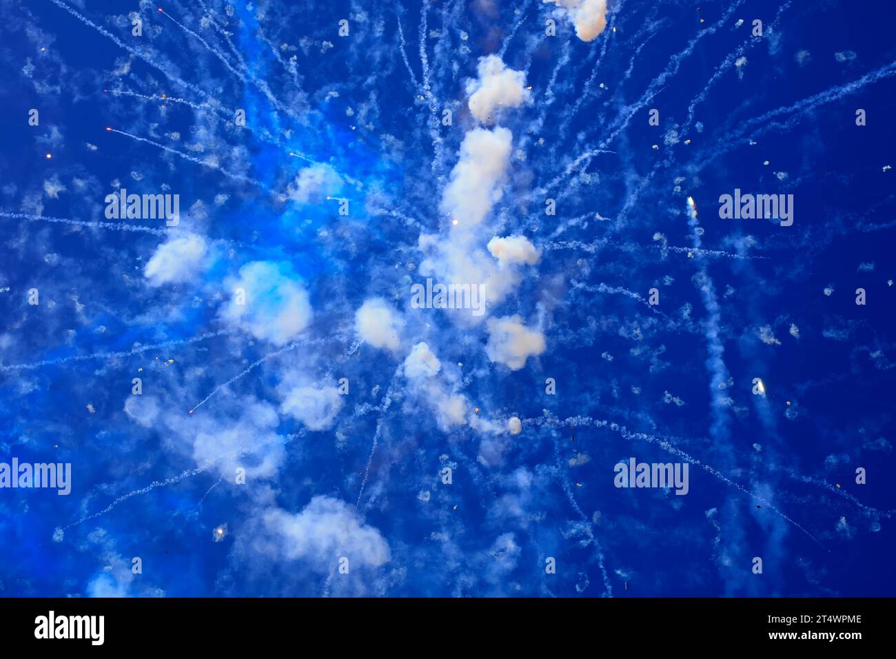 Fireworks explode, smoke in the blue sky Stock Photo - Alamy