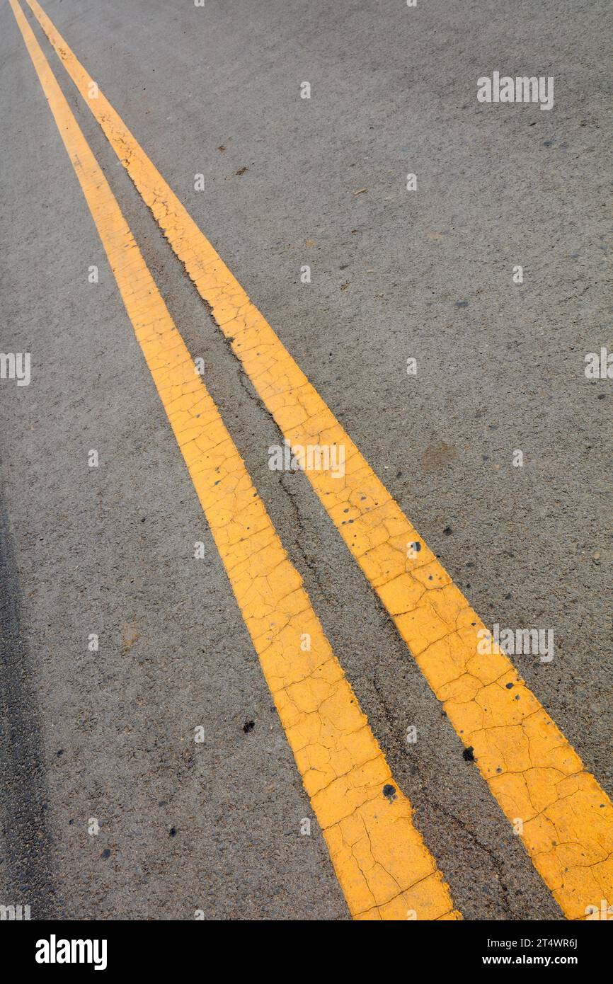 Yellow double solid line Stock Photo - Alamy