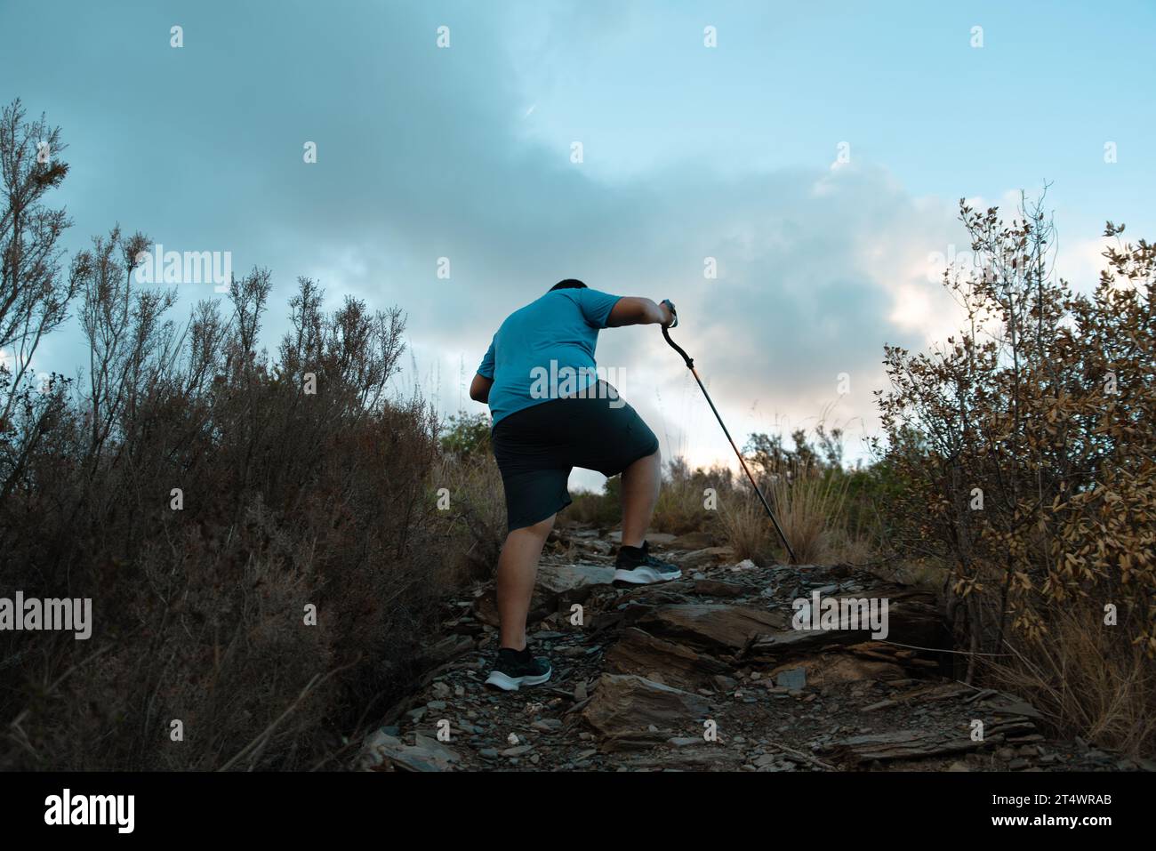 Man trains in the mountains in his fight against being overweight Stock ...