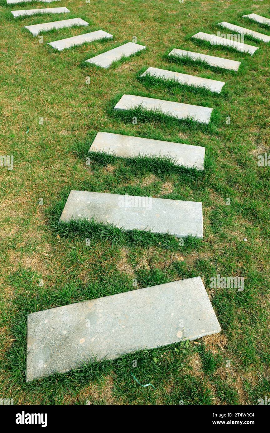 slate path is on the lawn Stock Photo - Alamy