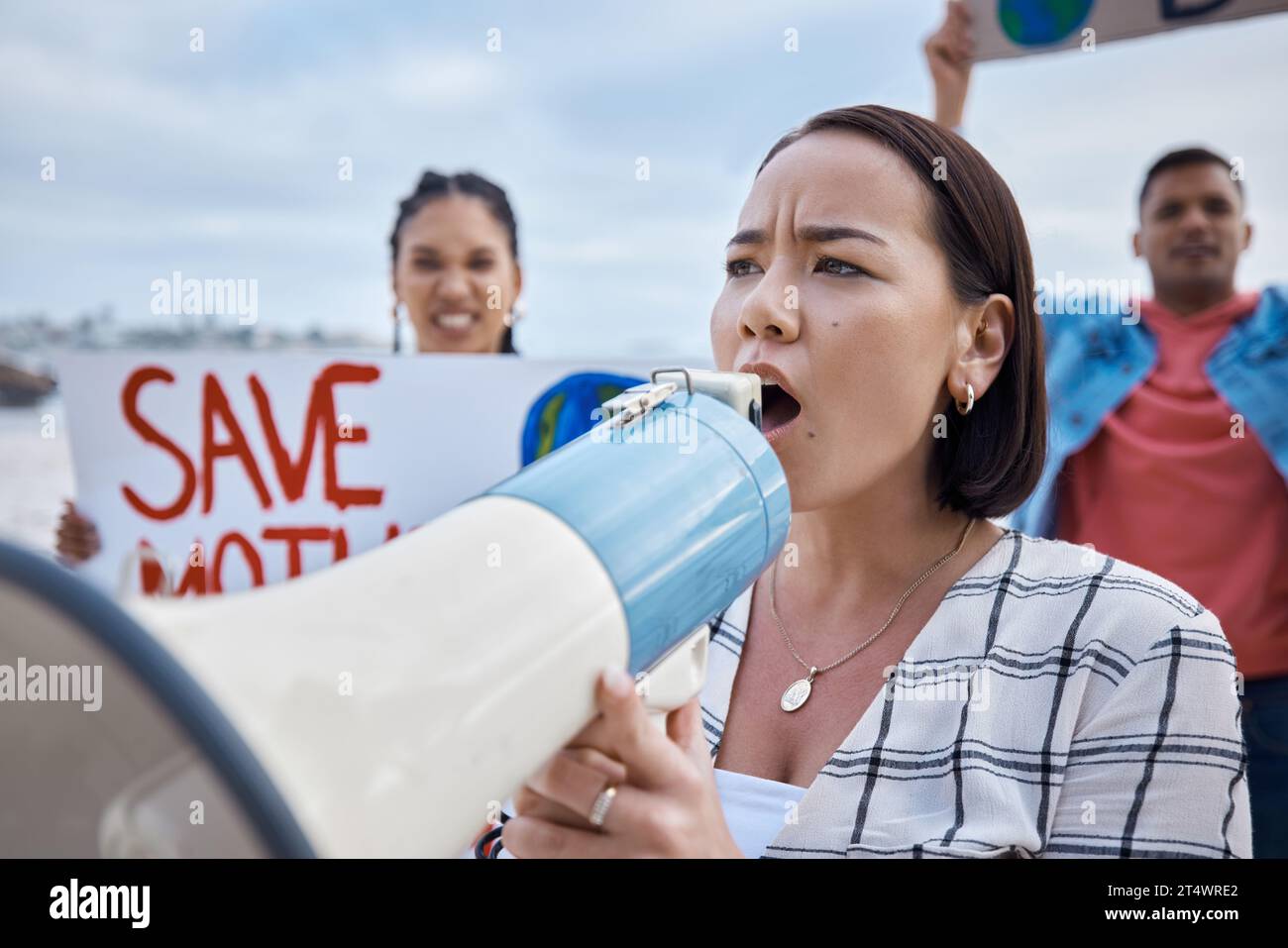 Climate change, megaphone and Asian woman protest with crowd protesting ...