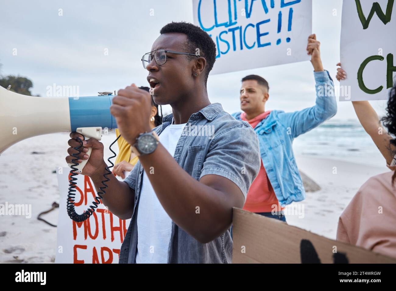 Protest, climate change and megaphone with black man at the beach for ...