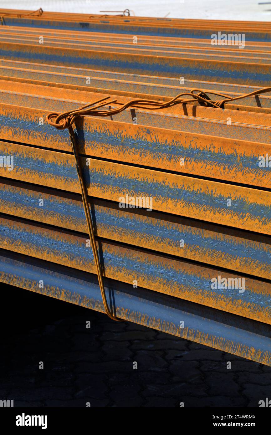 steel plate banding piled up together, closeup of photo Stock Photo - Alamy