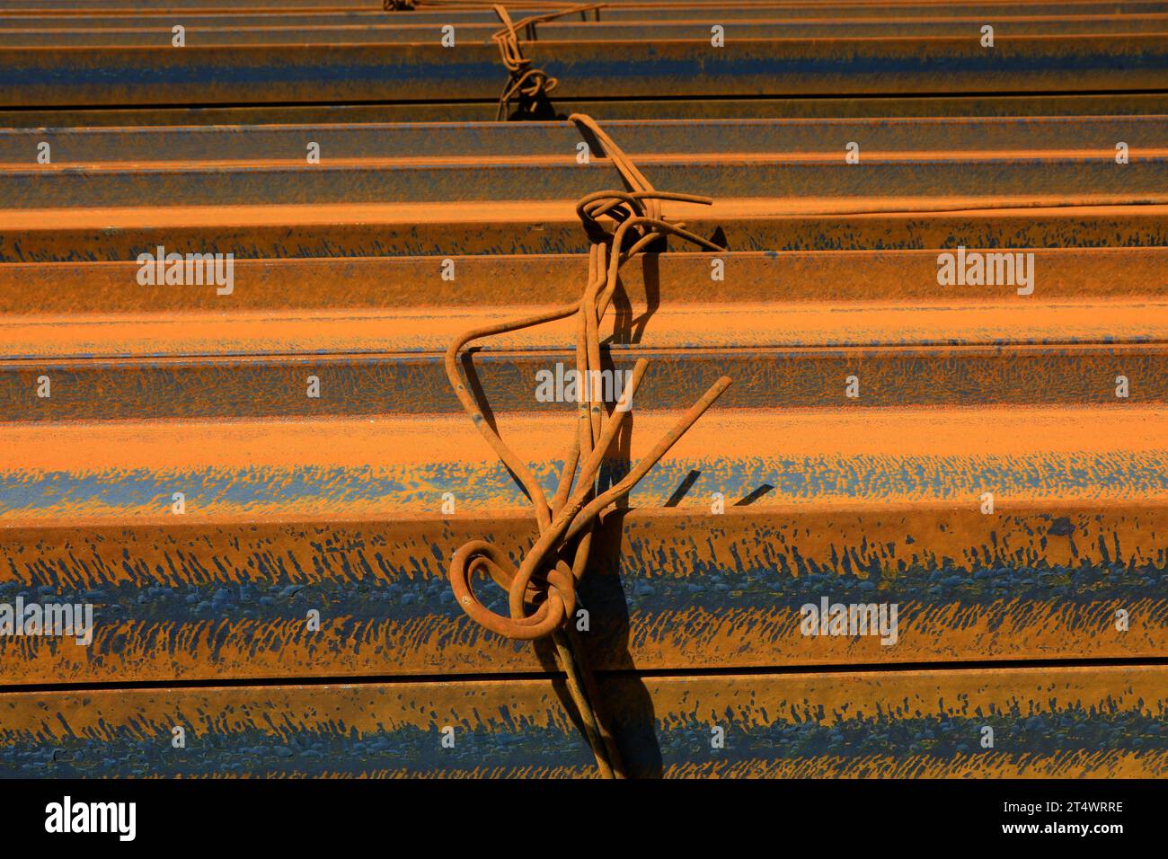 steel plate banding piled up together, closeup of photo Stock Photo - Alamy