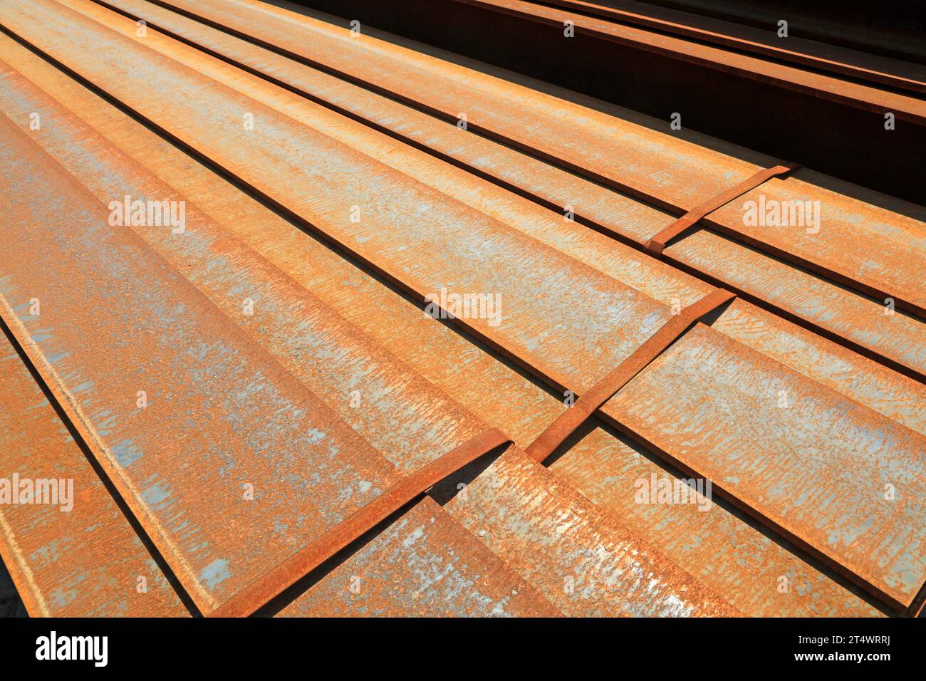 steel plate banding piled up together, closeup of photo Stock Photo - Alamy