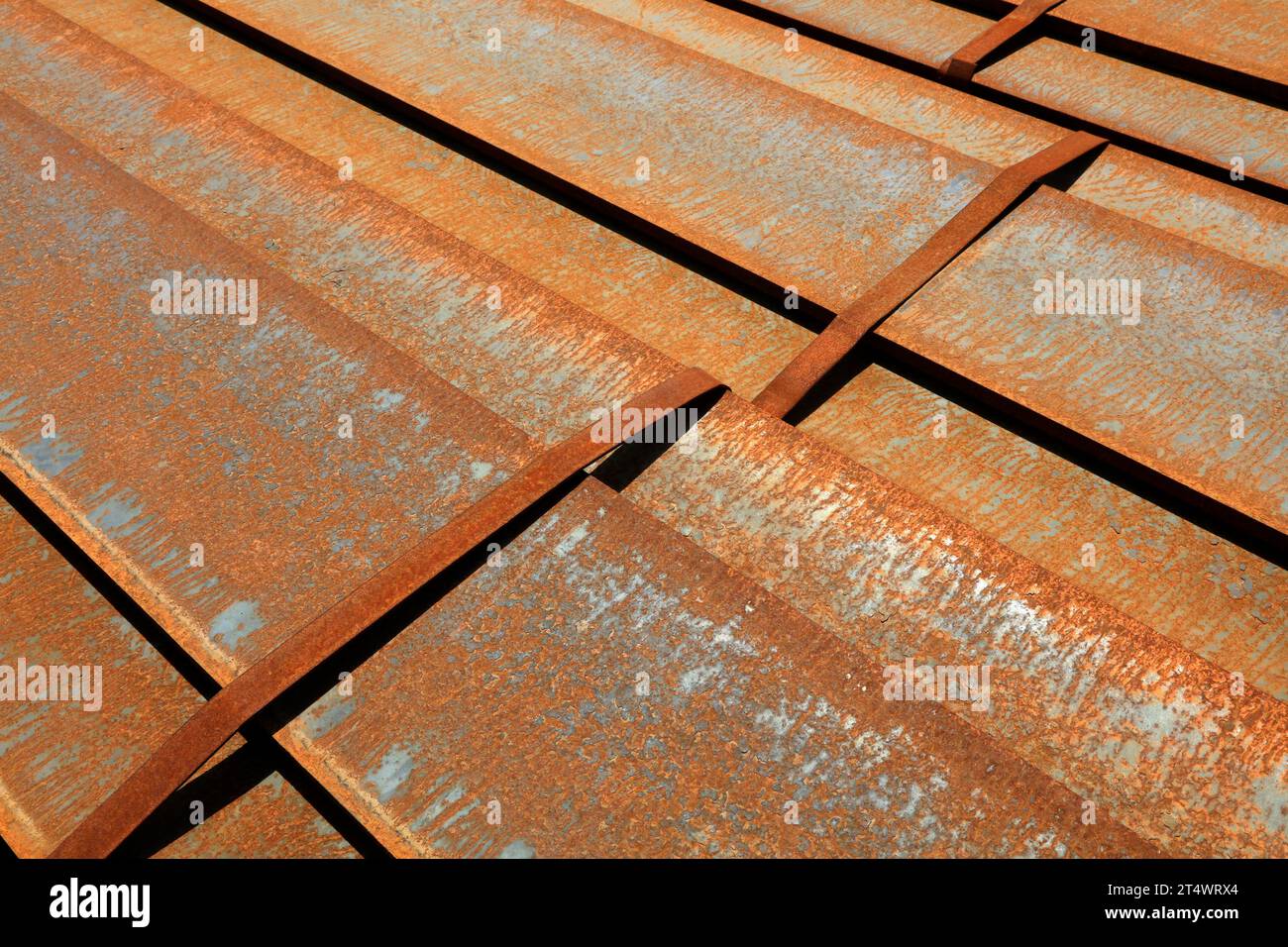 steel plate banding piled up together, closeup of photo Stock Photo - Alamy