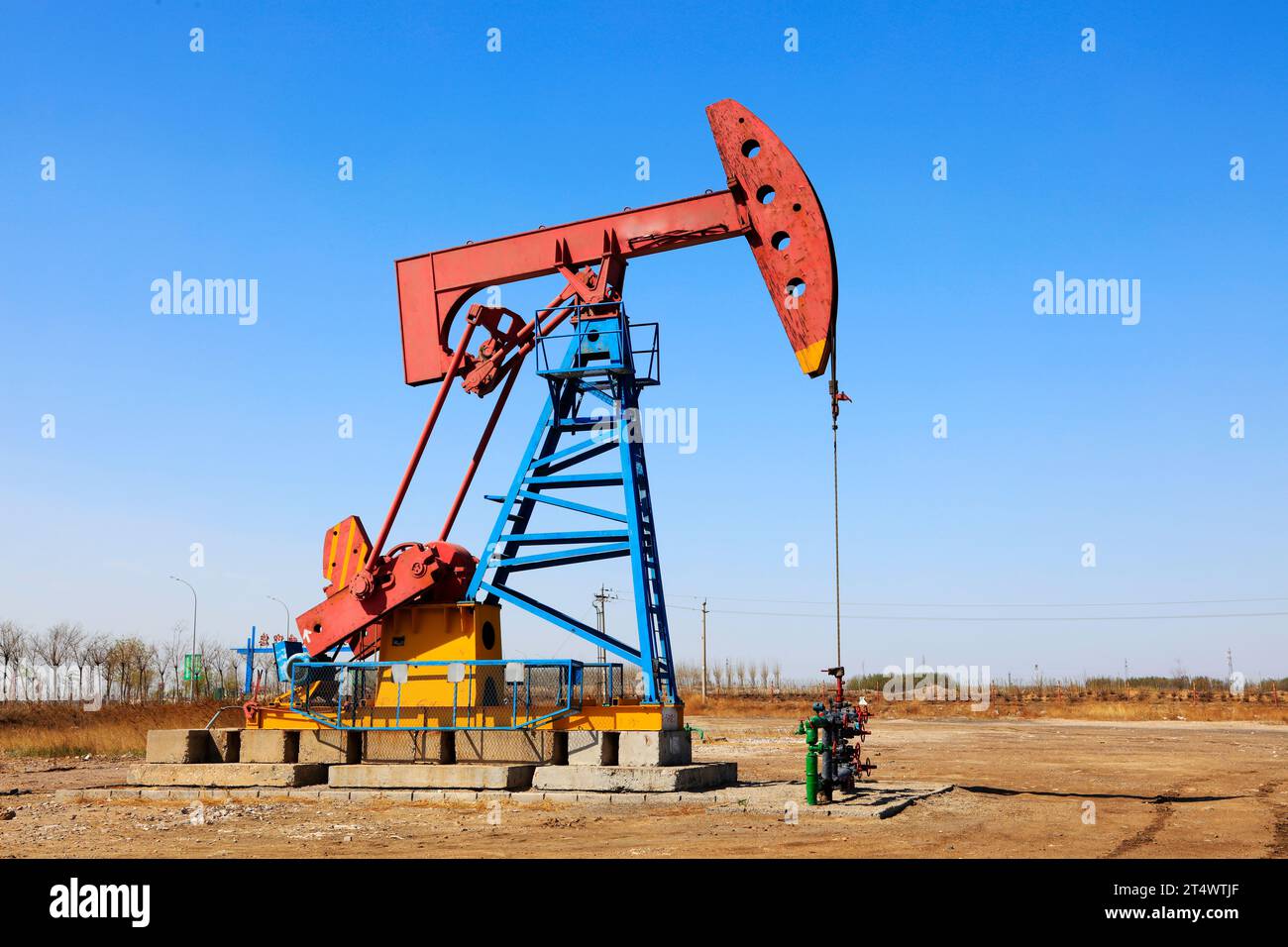 Crank balanced beam pumping unit in the oil field Stock Photo - Alamy