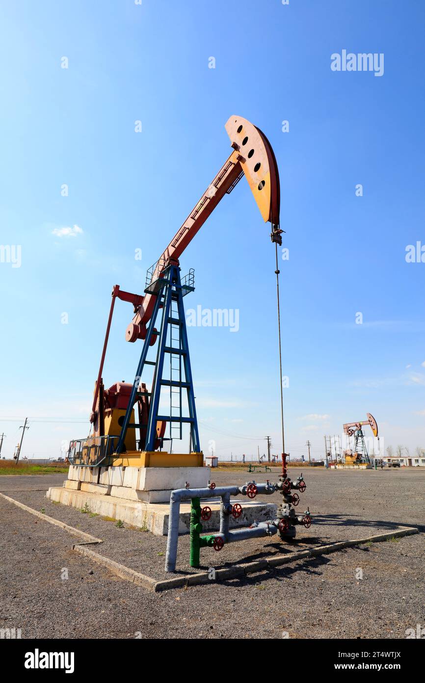 Crank balanced beam pumping unit in the oil field Stock Photo - Alamy