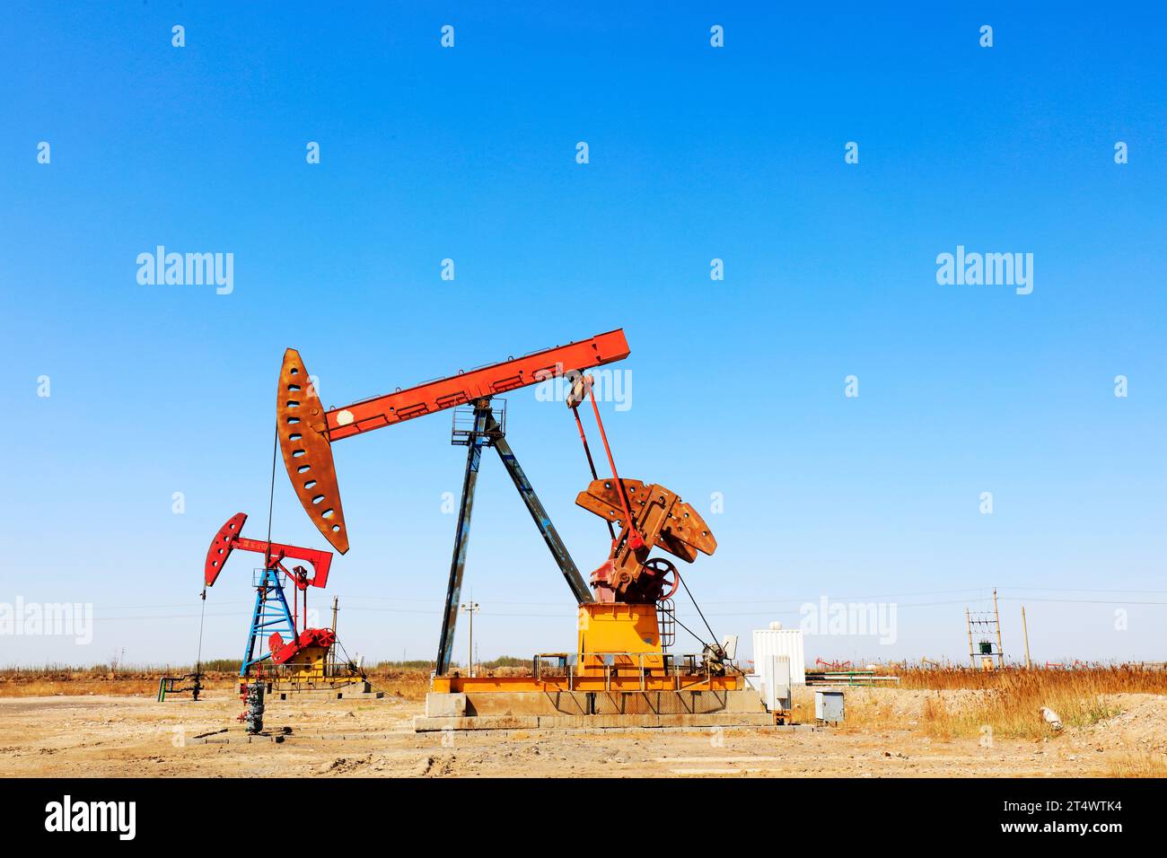 Crank balanced beam pumping unit in the oil field Stock Photo - Alamy