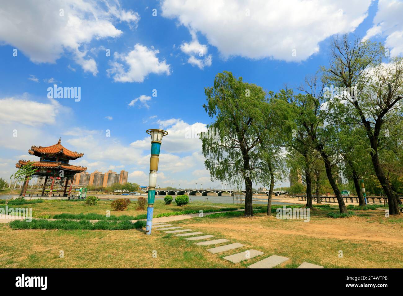 Pavilions and green trees in the park Stock Photo - Alamy