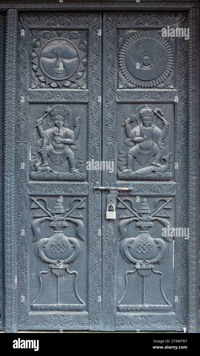 Nepal spirit and beauty. Old wooden door. Woodwork is amazing Stock ...